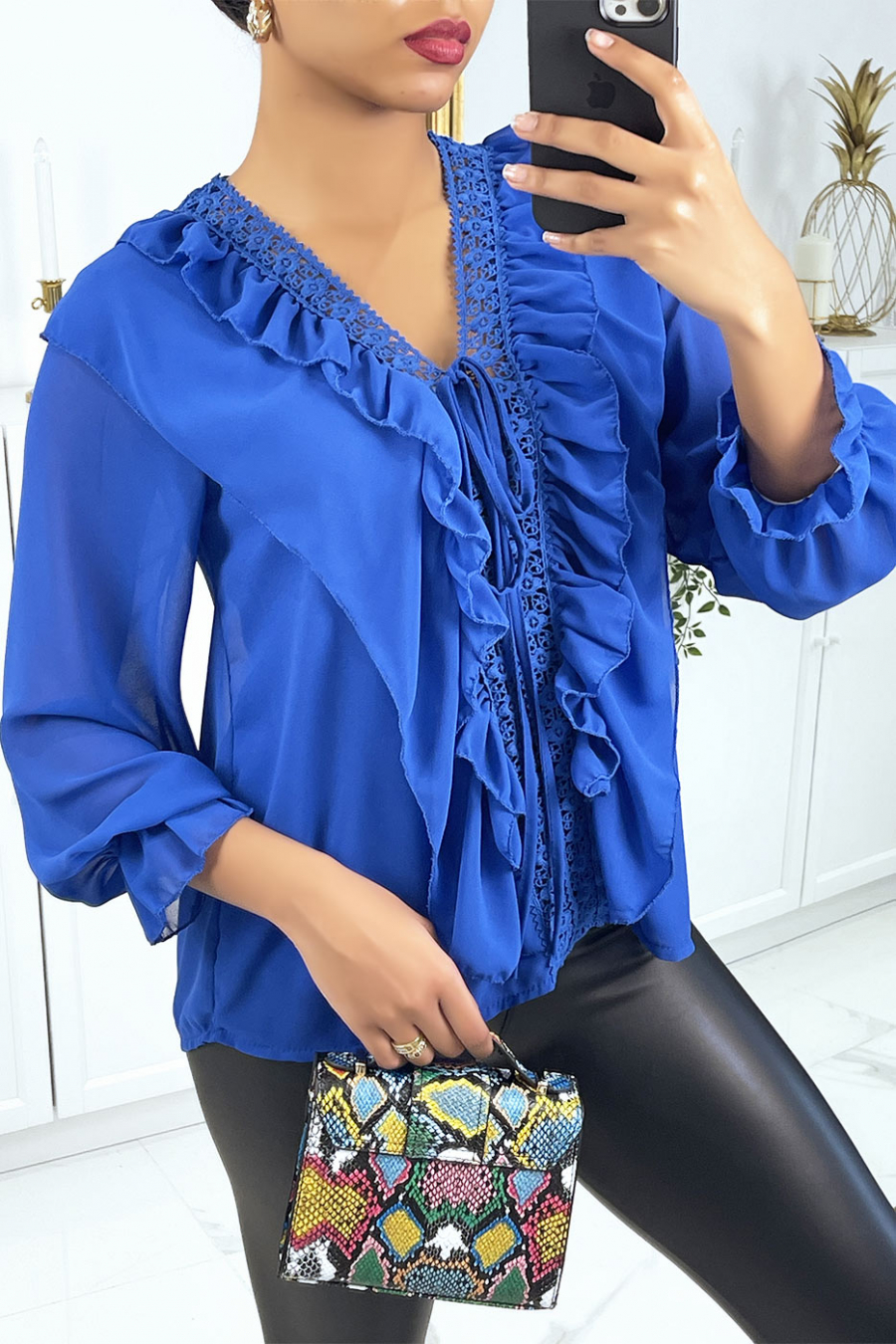 Blouse with ruffles and blue embroidery