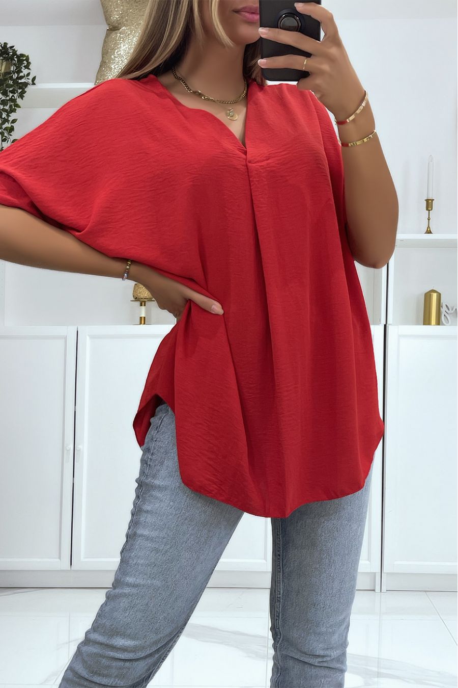 Solid color red oversized top with V-neck and batwing effect sleeves