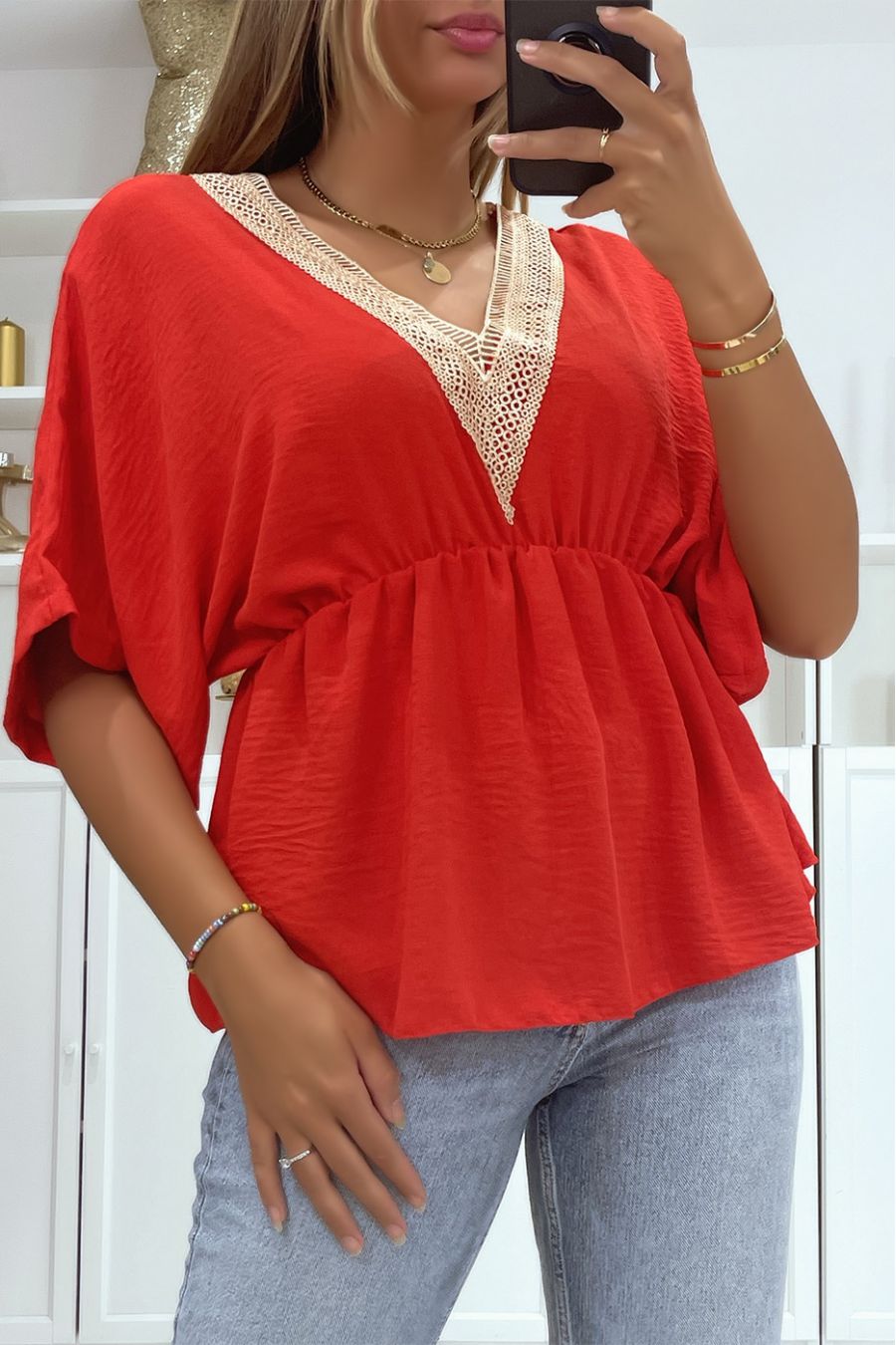 Red top with golden thread details, oriental style, elastic at the waist