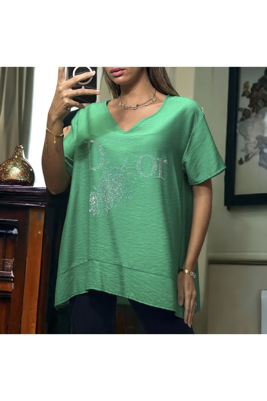 Green oversize tunic with inspired drawing and writing in rhinestones