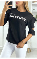 Black t-shirt with frou frou open sleeves and you and me writing